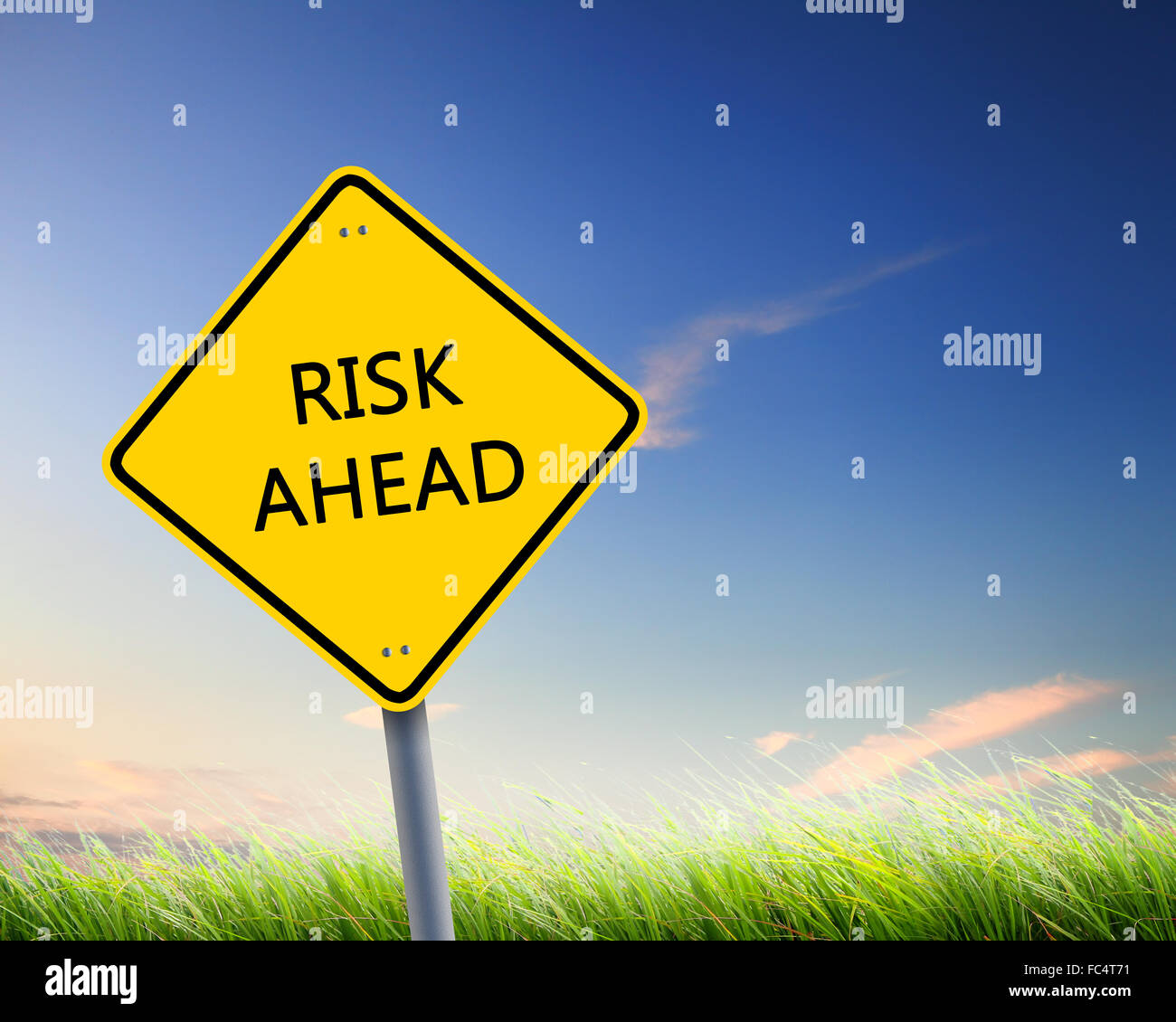 yellow road sign as a warning of risk ahead Stock Photo - Alamy