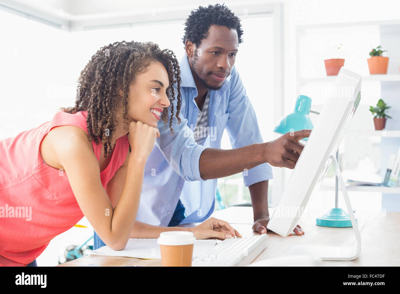 Two creative business colleagues watching the computer Stock Photo - Alamy