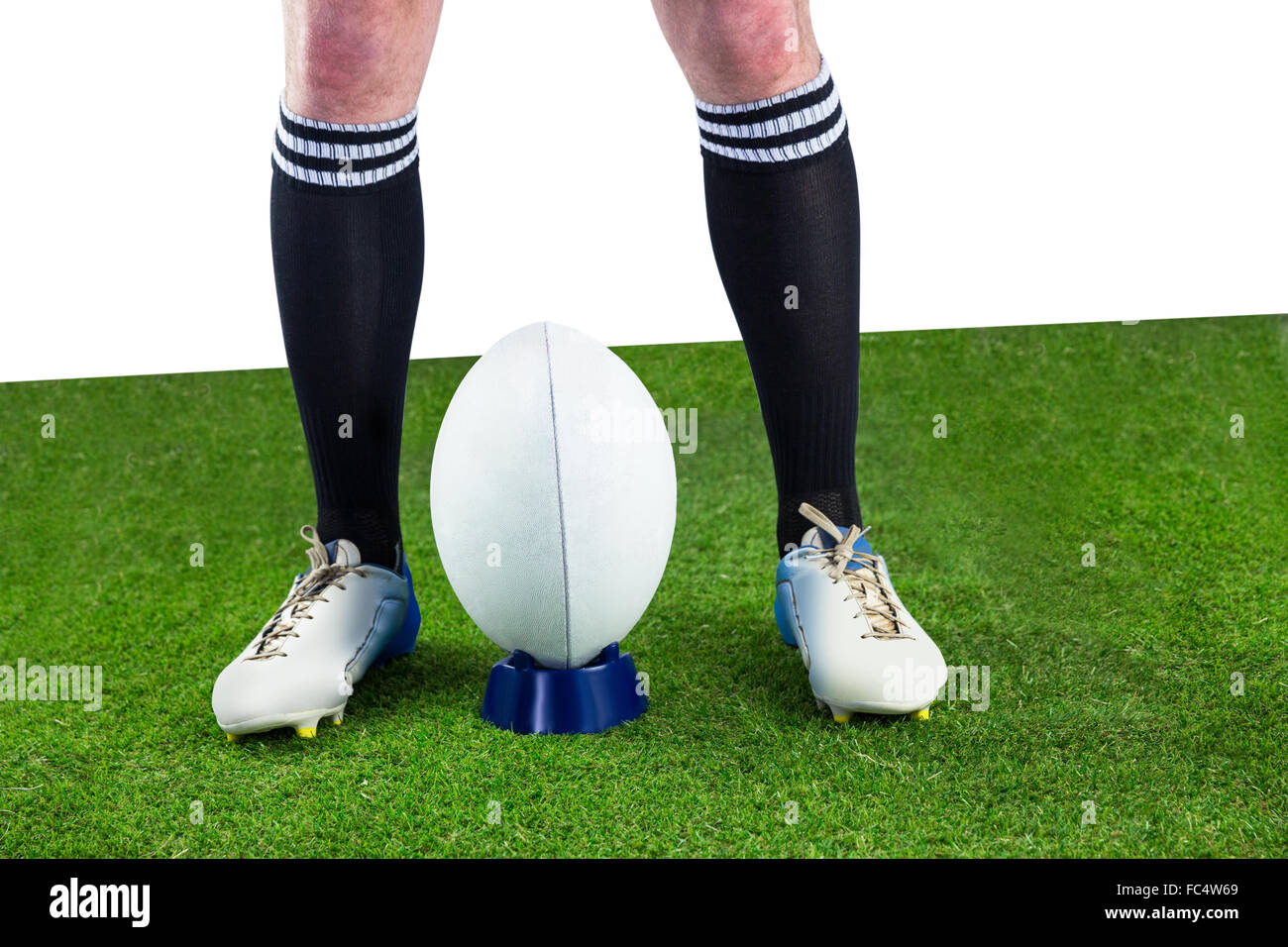Rugby player ready to make a drop kick Stock Photo - Alamy