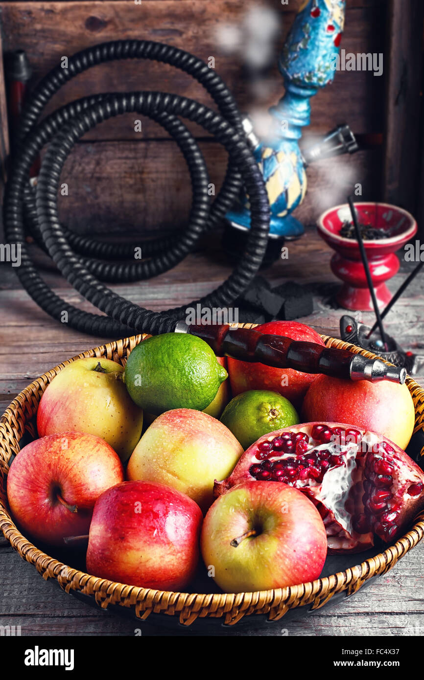 Stylish Smoking hookah and basket with apples,pomegranate and lime ...