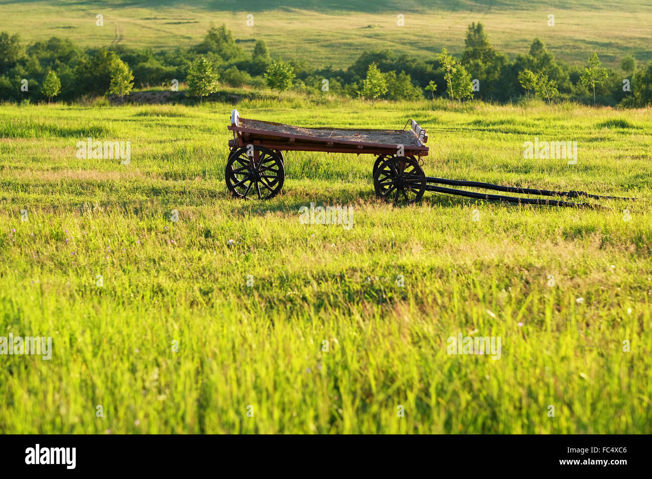 Rural landscape with wooden cart Stock Photo - Alamy