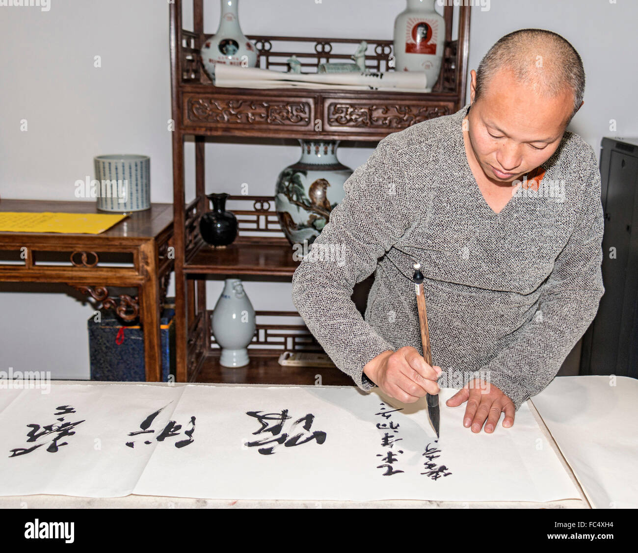 Calligrapher calligraphy man writing hi-res stock photography and ...