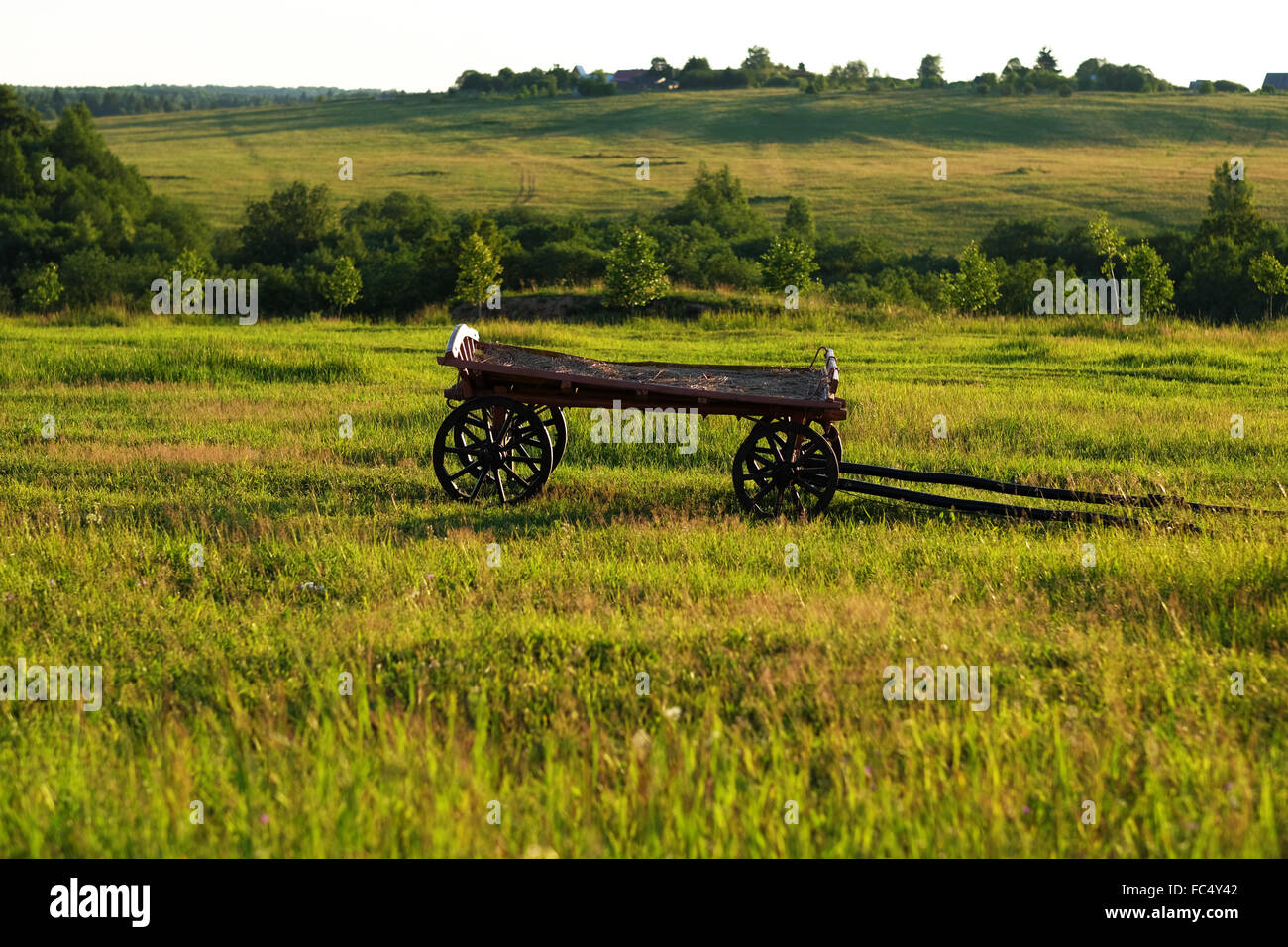 Rural landscape with wooden cart Stock Photo - Alamy