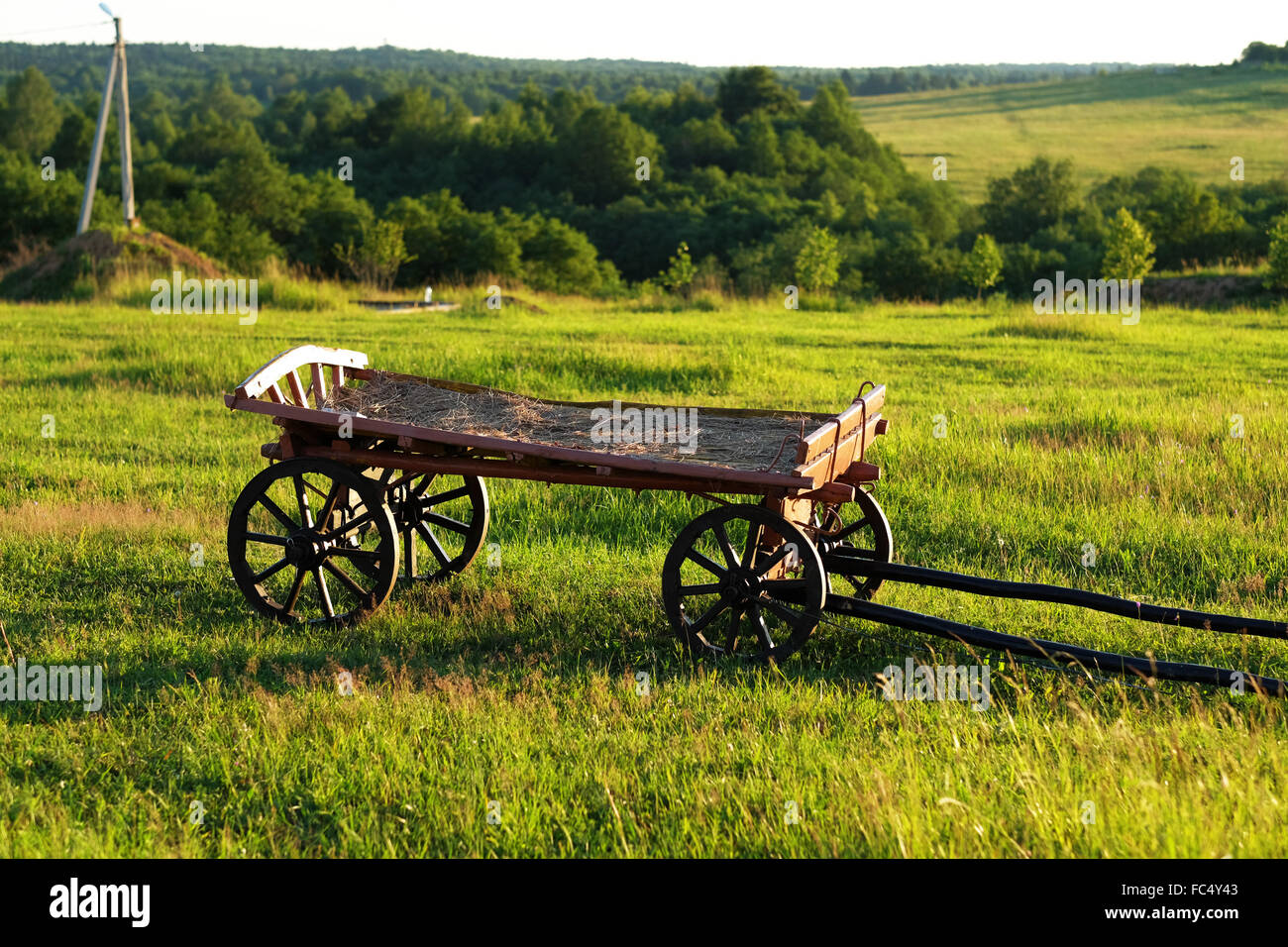 Rural landscape with wooden cart Stock Photo - Alamy