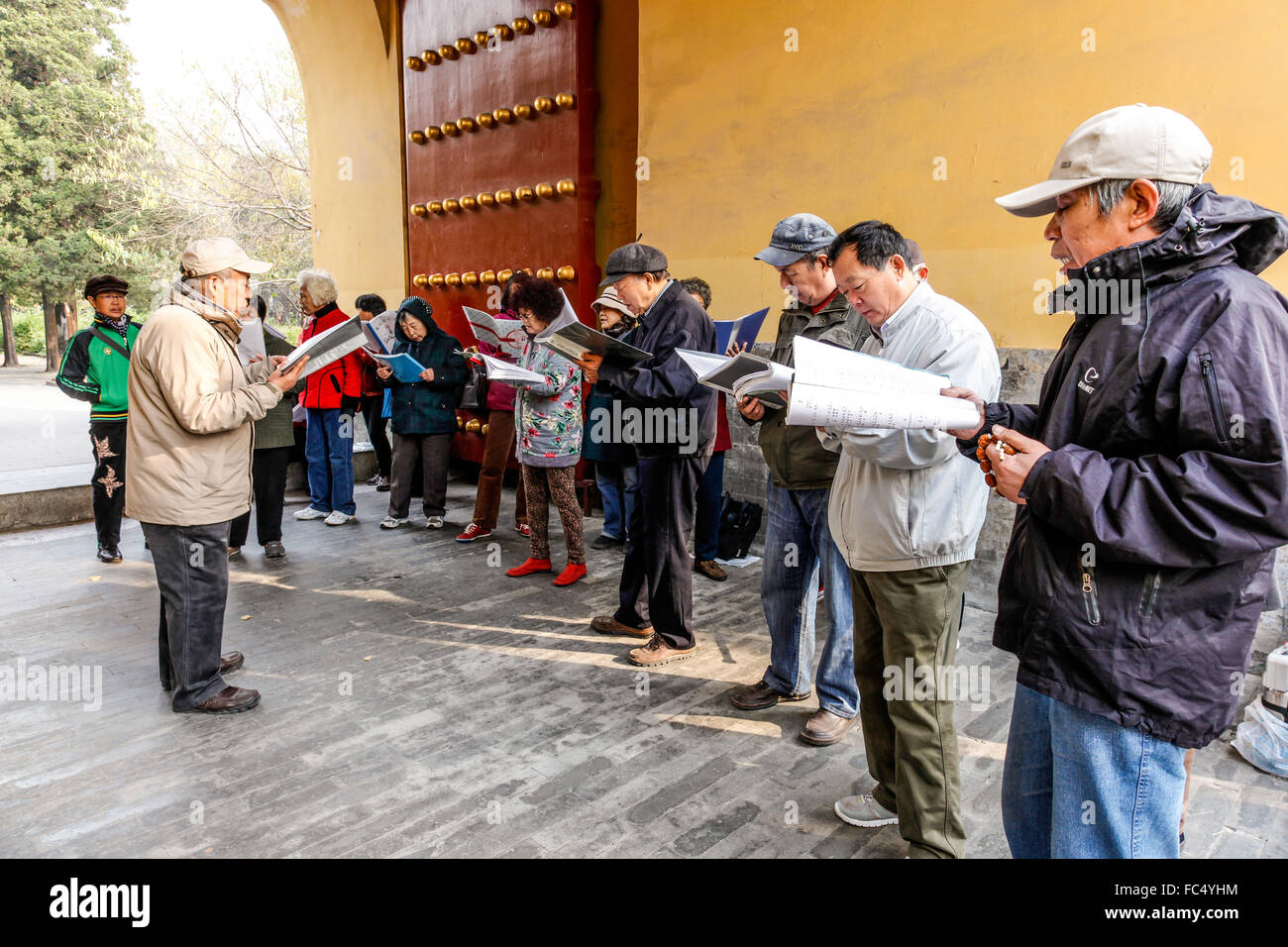 Chinese mens choir singing at The Temple of Heaven gates in Beijing ...