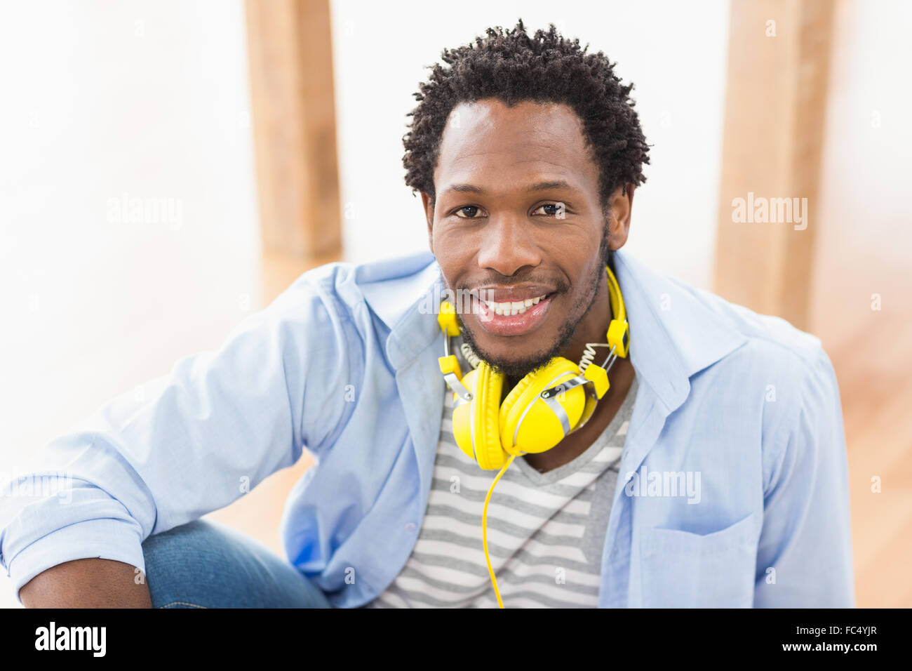 Young creative businessman with headphones around neck Stock Photo - Alamy