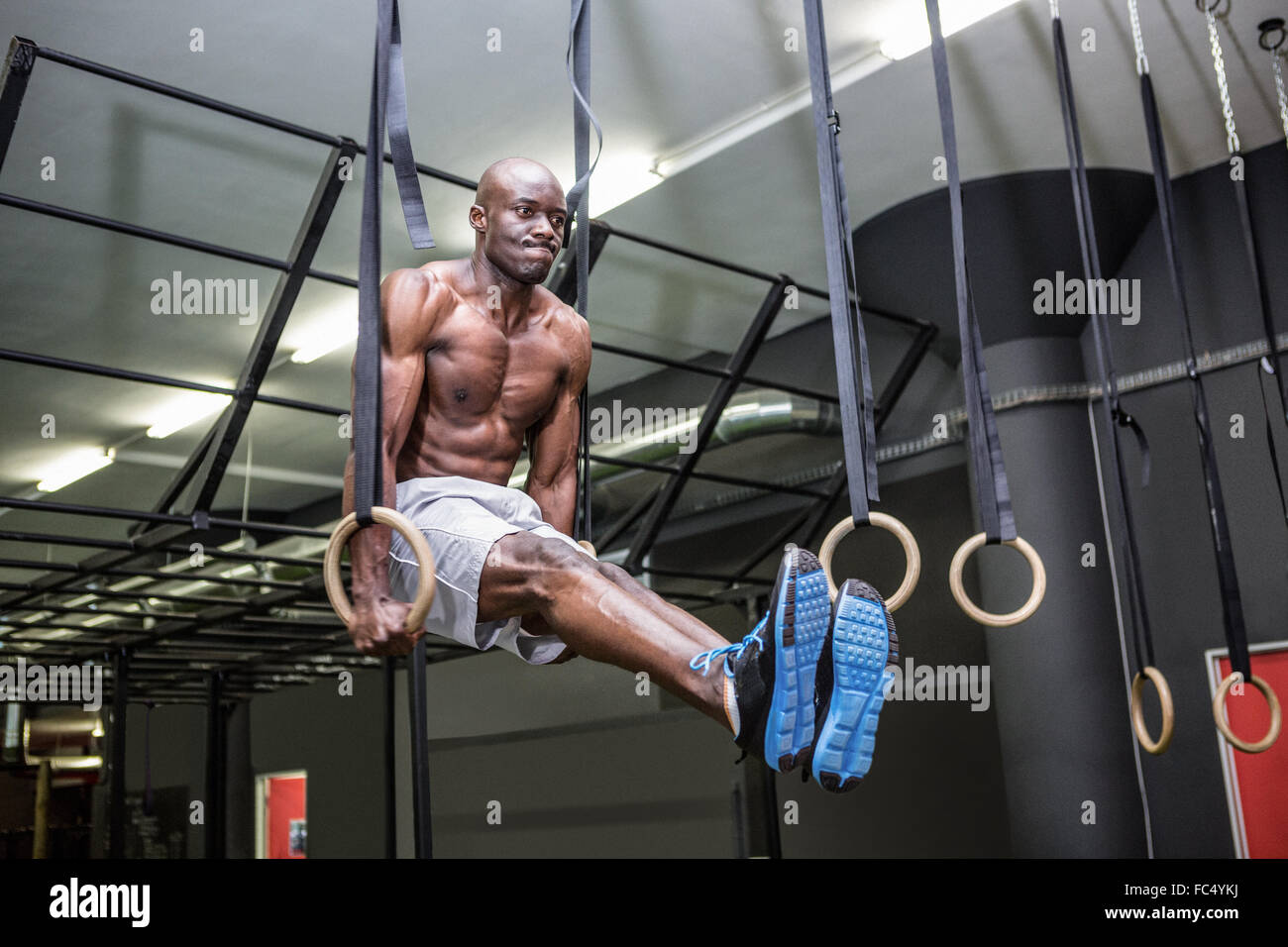 Young Bodybuilder lifting himself up and down Stock Photo - Alamy