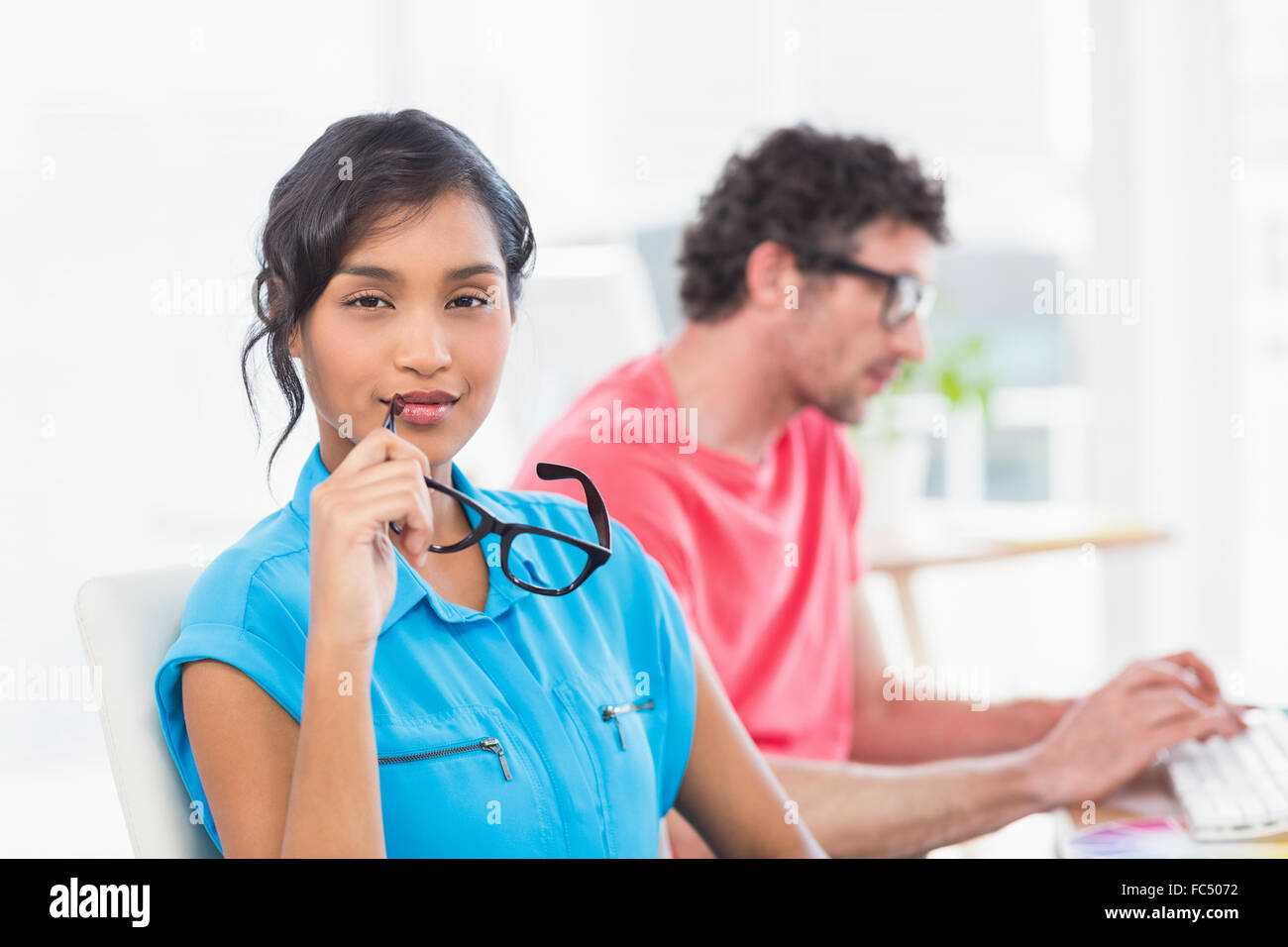Smiling casual business team working together Stock Photo - Alamy Smiling casual business team working together Stock Photo - Alamy