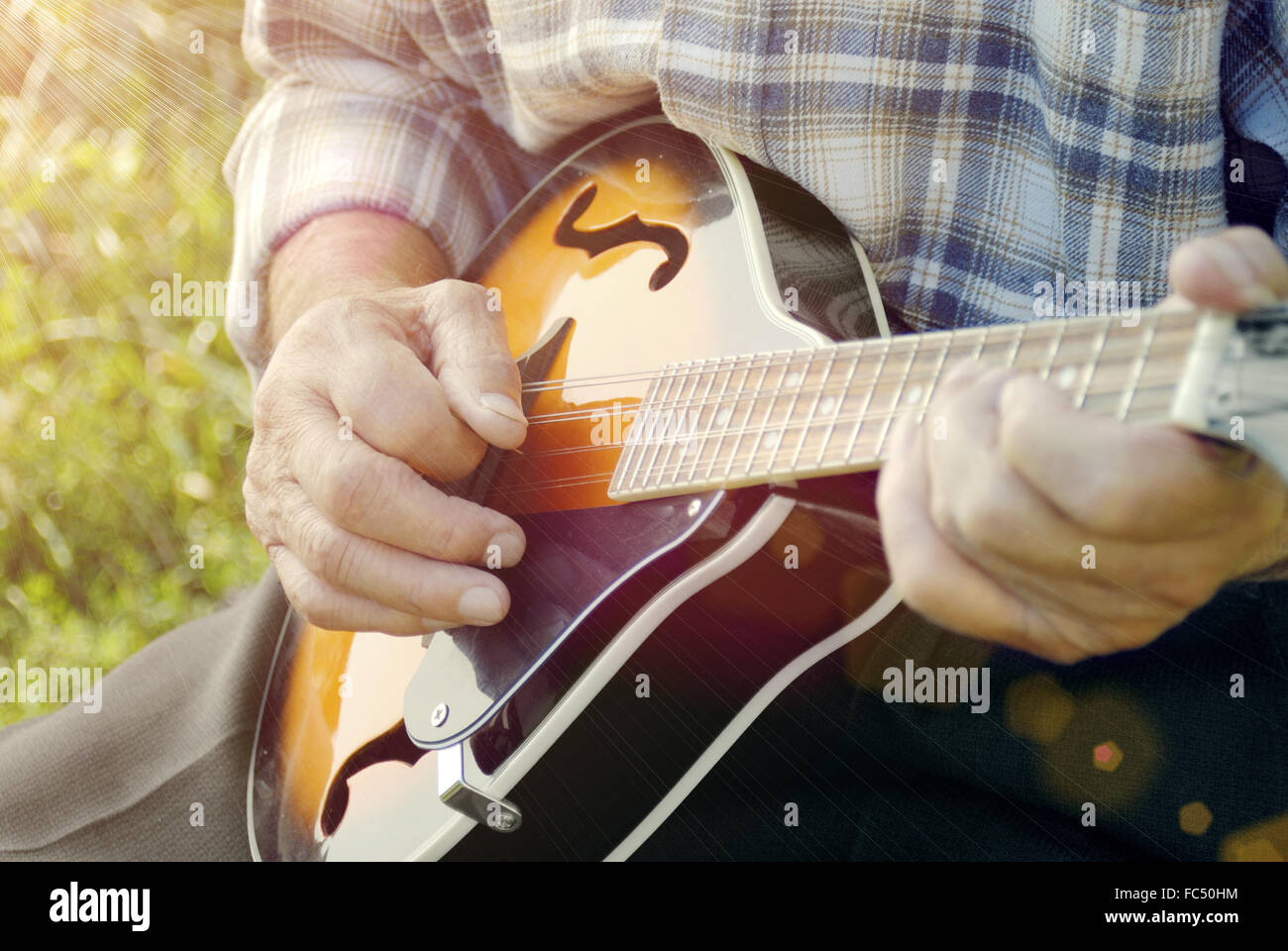 Senior man playing mandolin Stock Photo - Alamy
