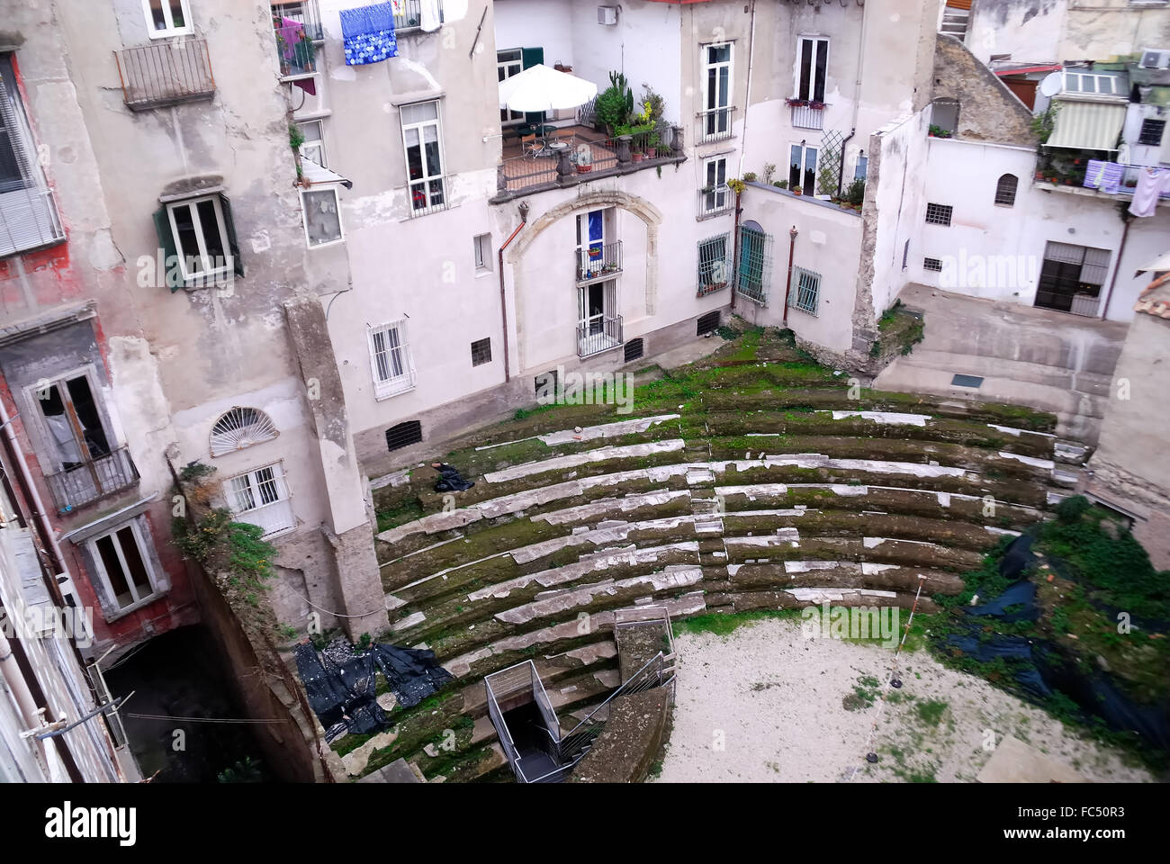 Naples, Italy. The Roman theater of Neapolis surrounded by the houses ...