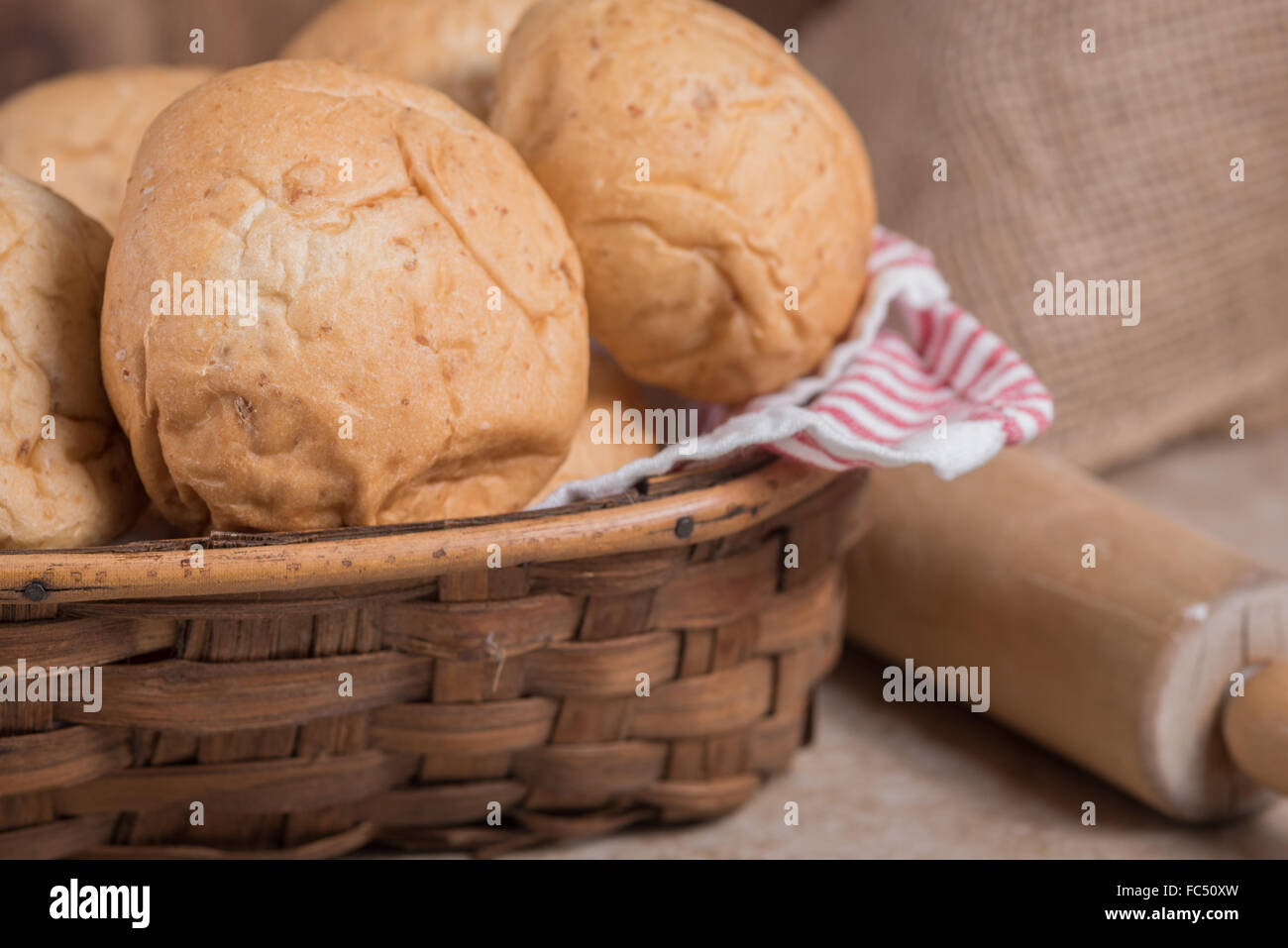 Wheat dinner bread rolls in a basket Stock Photo - Alamy