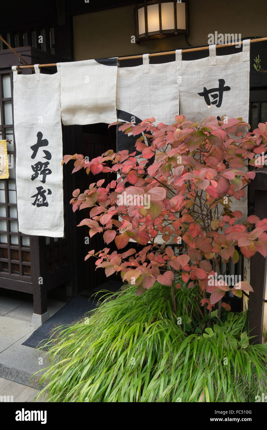 restaurant entrance with noren and foliage in Takayama Japan Stock ...