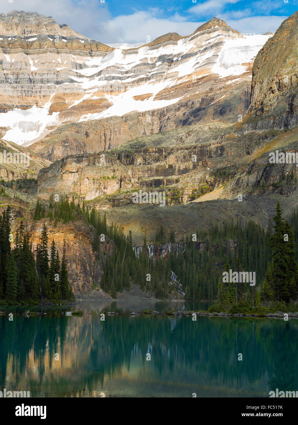 Low-angle view of beautiful, remote Lake O'Hara and Seven Veils Falls ...