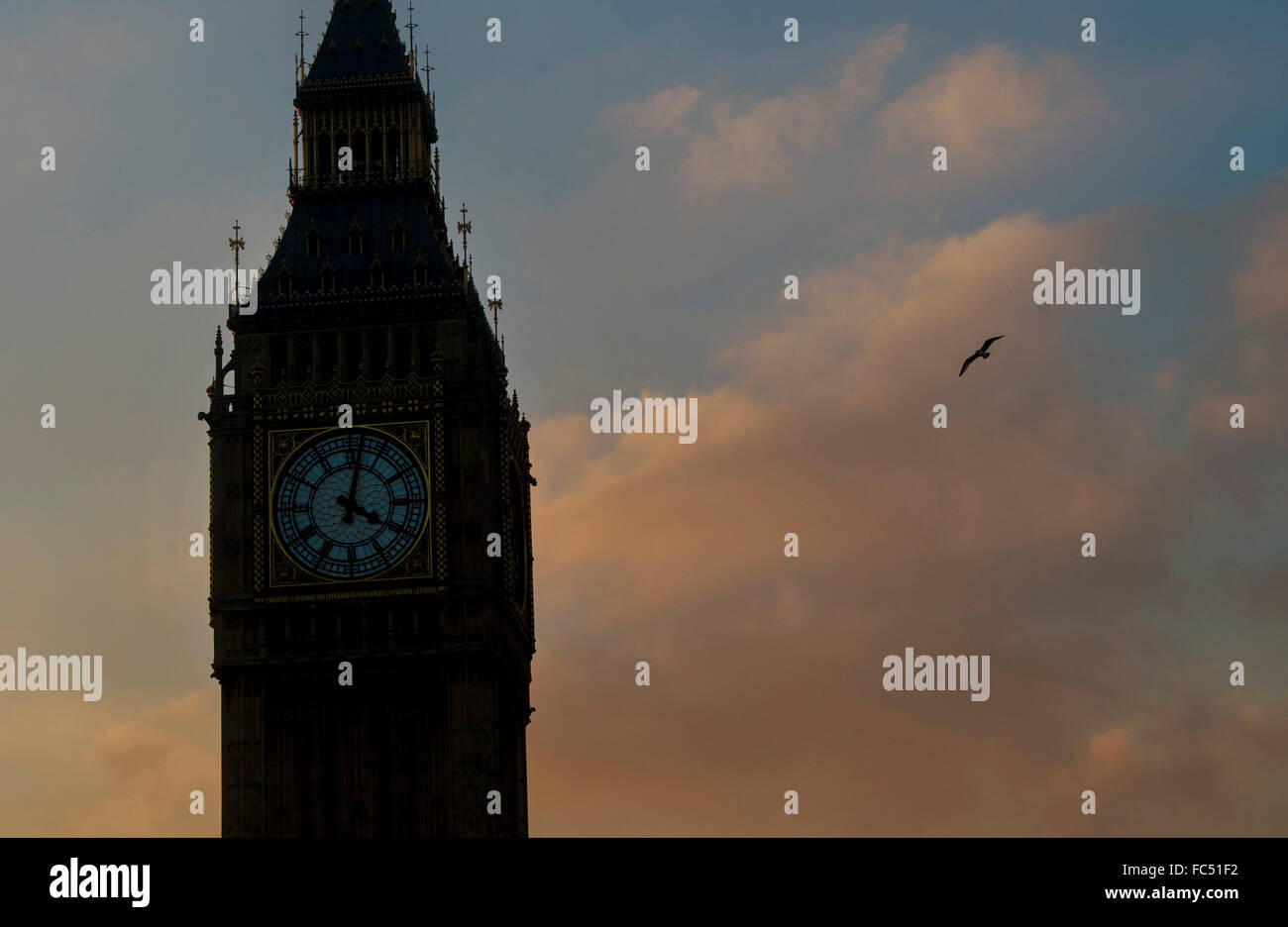 The sun sets behind Big Ben in London Stock Photo - Alamy