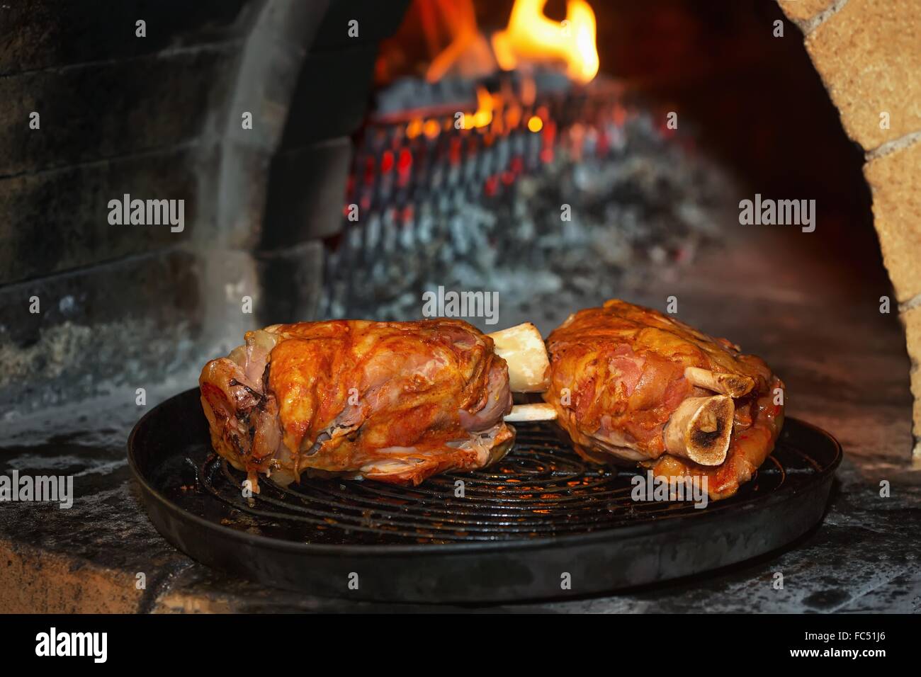 Roasted pork knuckle baked in a brick oven Stock Photo - Alamy