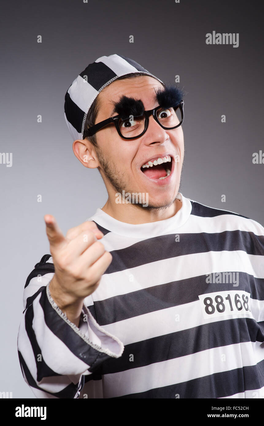Funny prisoner isolated on gray Stock Photo - Alamy