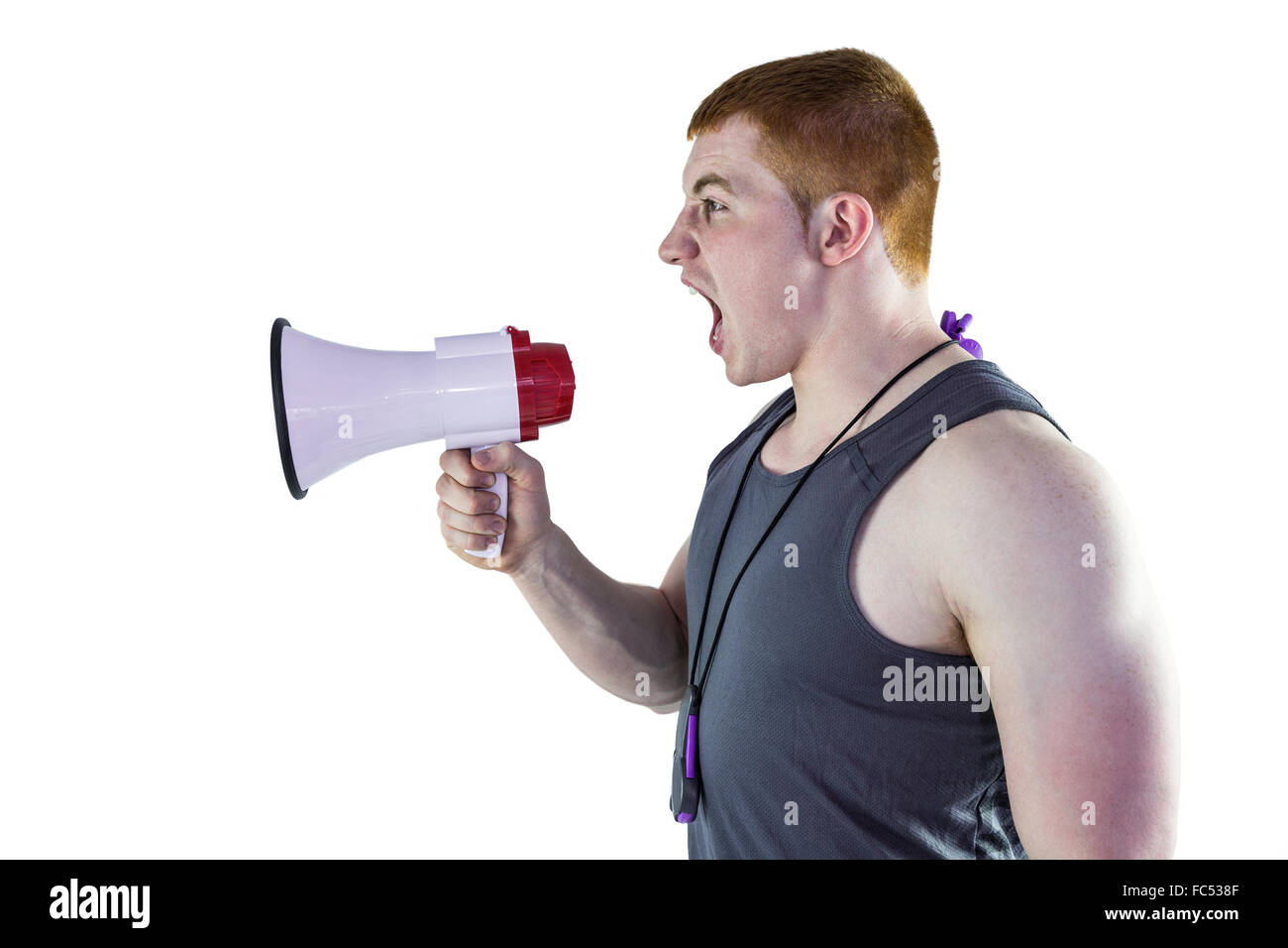 Angry personal trainer yelling through megaphone Stock Photo - Alamy