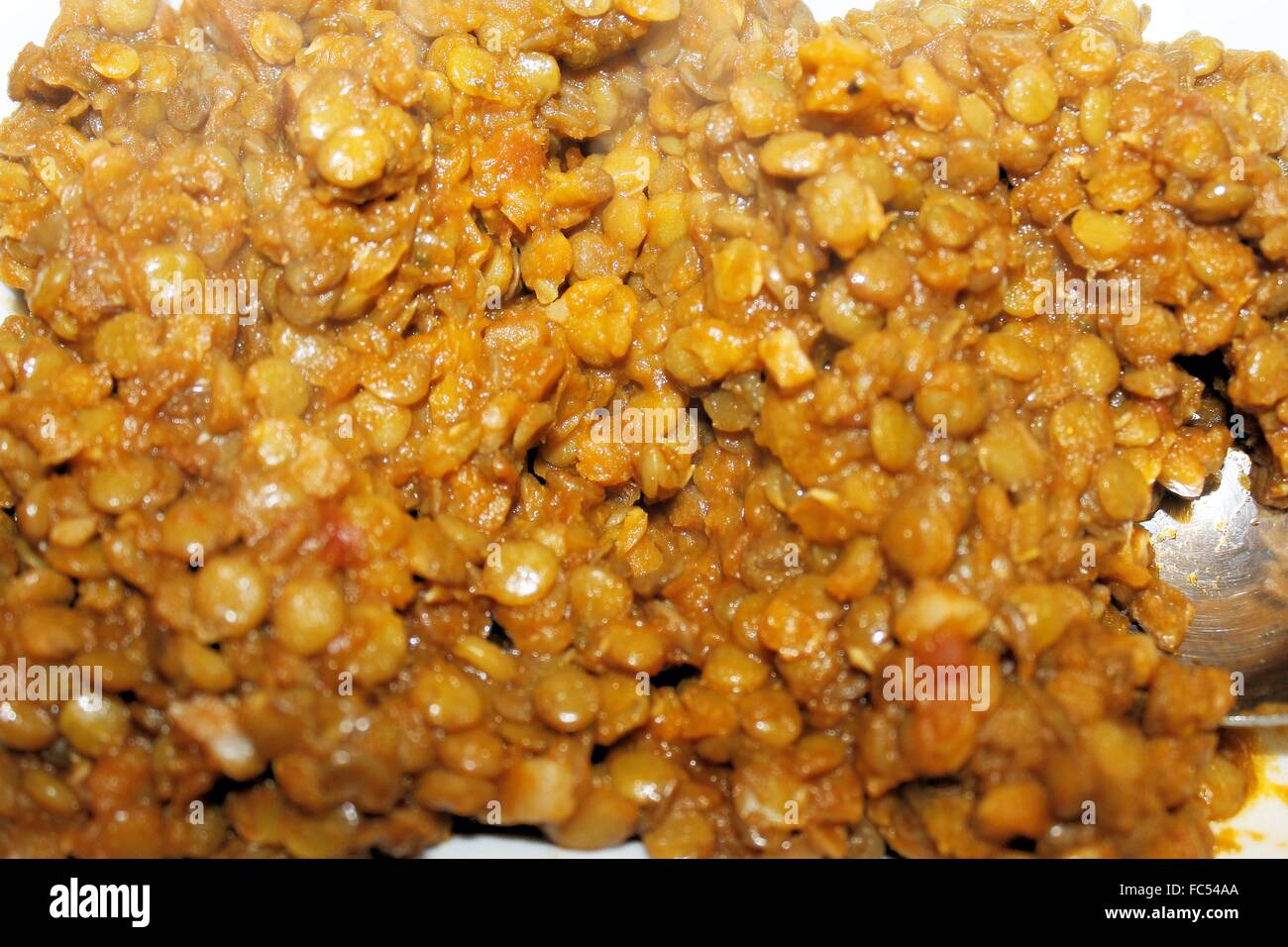 lentils with onion, tomato in the plate Stock Photo - Alamy