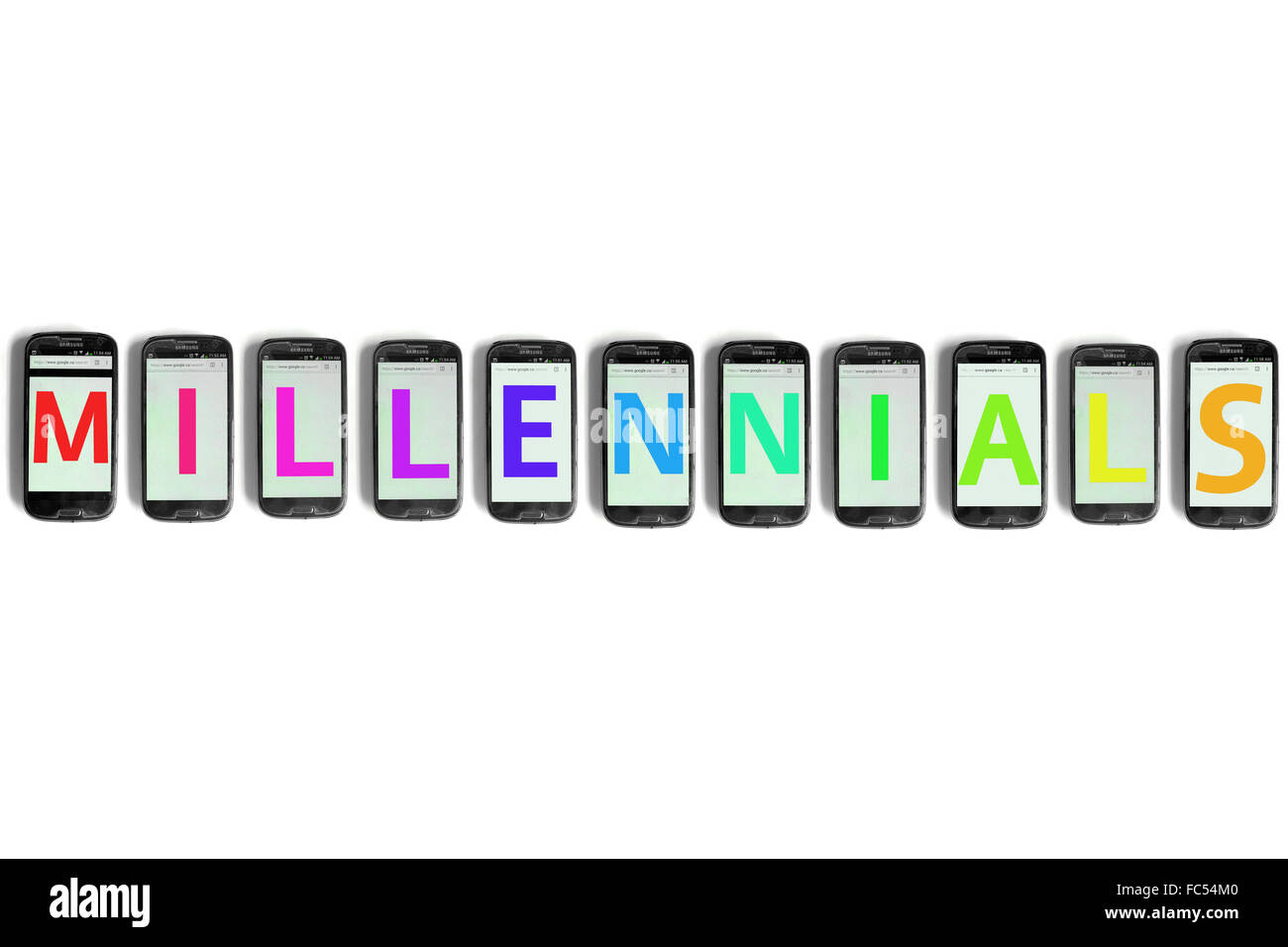 Millennials written on the screens of smartphones photographed against ...
