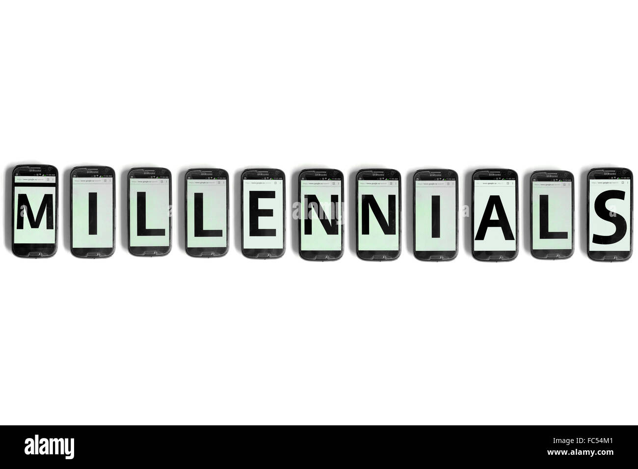 Millennials written on the screens of smartphones photographed against ...