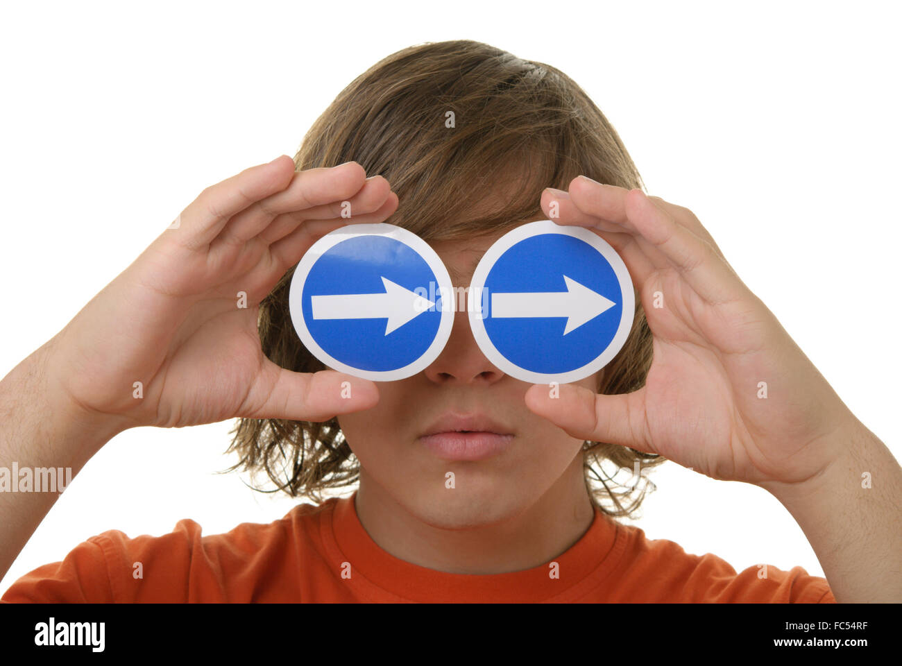 Teenager holds before eyes signs with arrows Stock Photo - Alamy