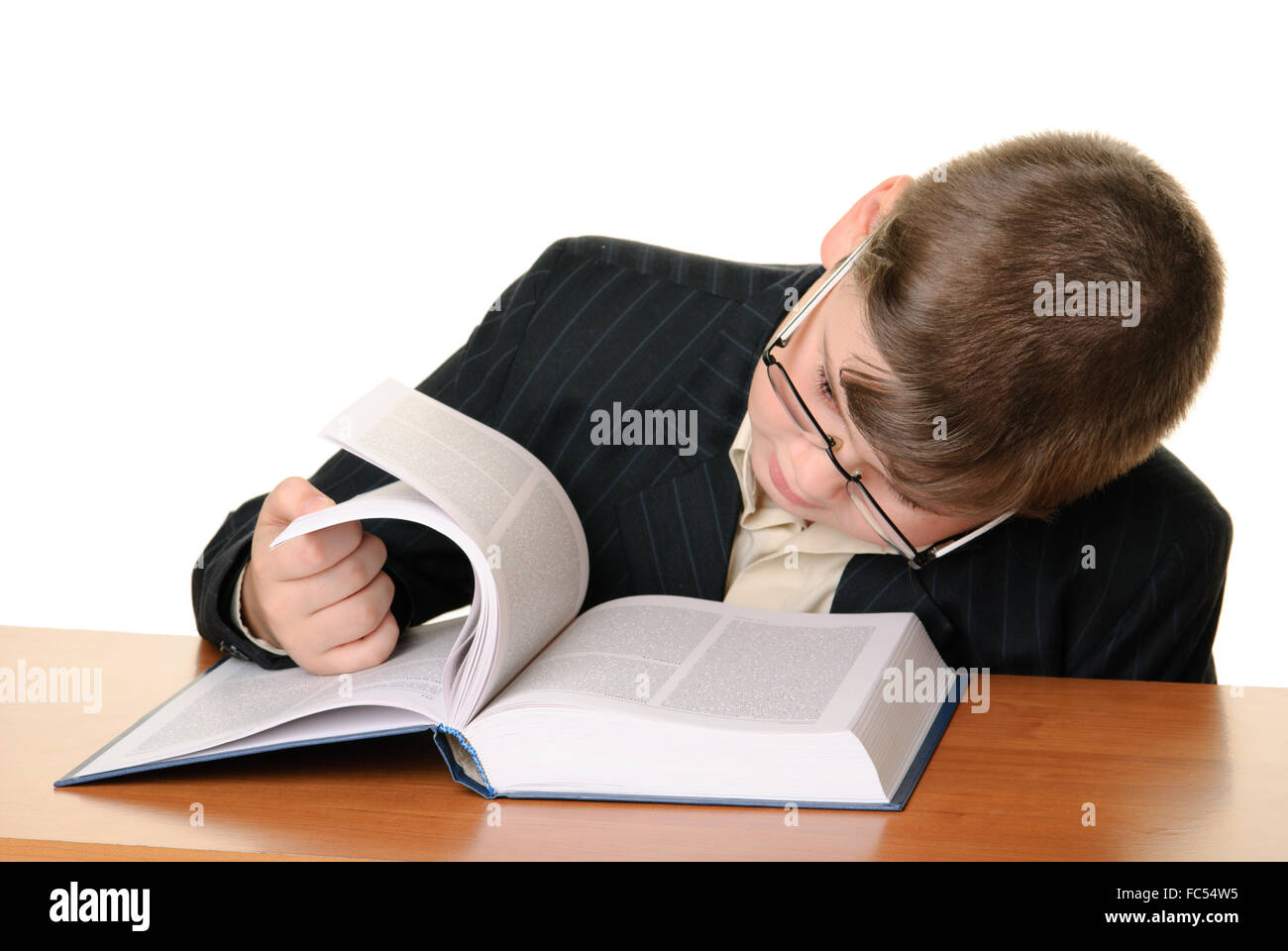 Boy with points reads book Stock Photo - Alamy