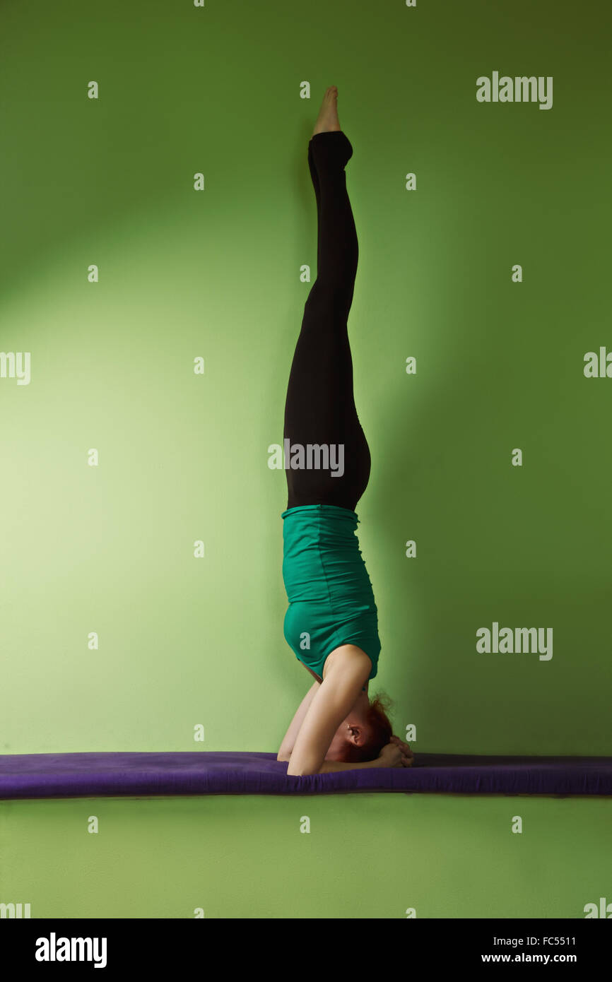 Yoga headstand red hi-res stock photography and images - Alamy