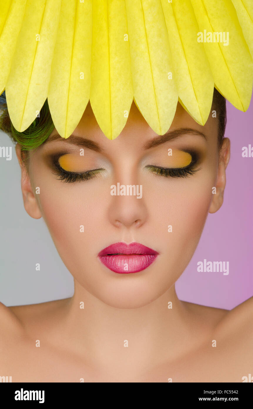 Beautiful woman with yellow paper Stock Photo - Alamy