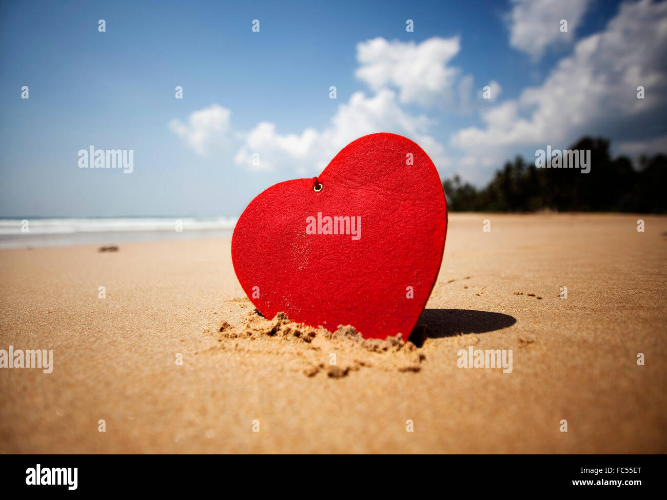 red heart on exotic sandy beach - Valentine's day concept Stock Photo ...