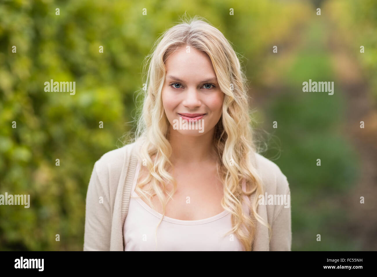 Smiling Woman looking at camera Stock Photo - Alamy