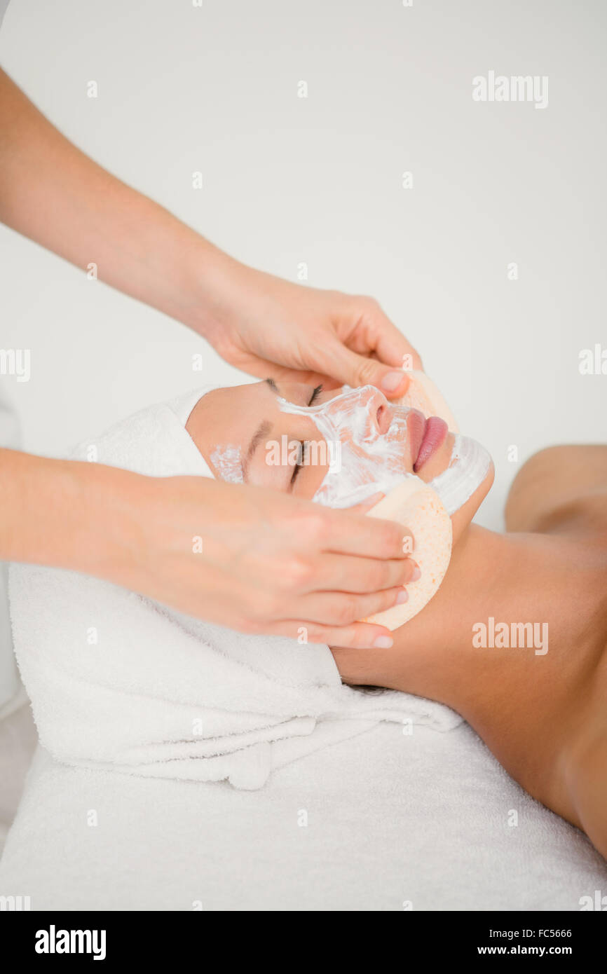 Hand cleaning womans face with cotton swabs with side view Stock Photo ...