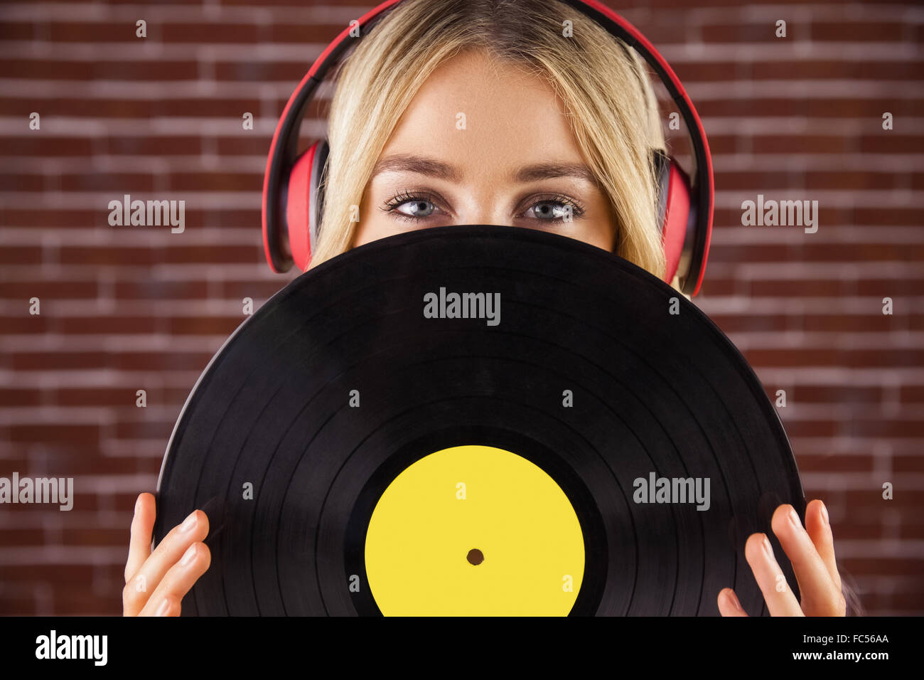 Portrait of a beautiful woman holding a vinyl Stock Photo - Alamy