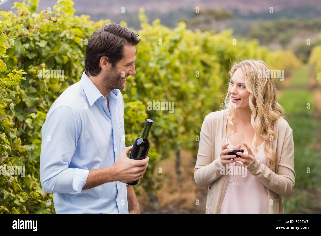 Young happy couple smiling at each other Stock Photo - Alamy