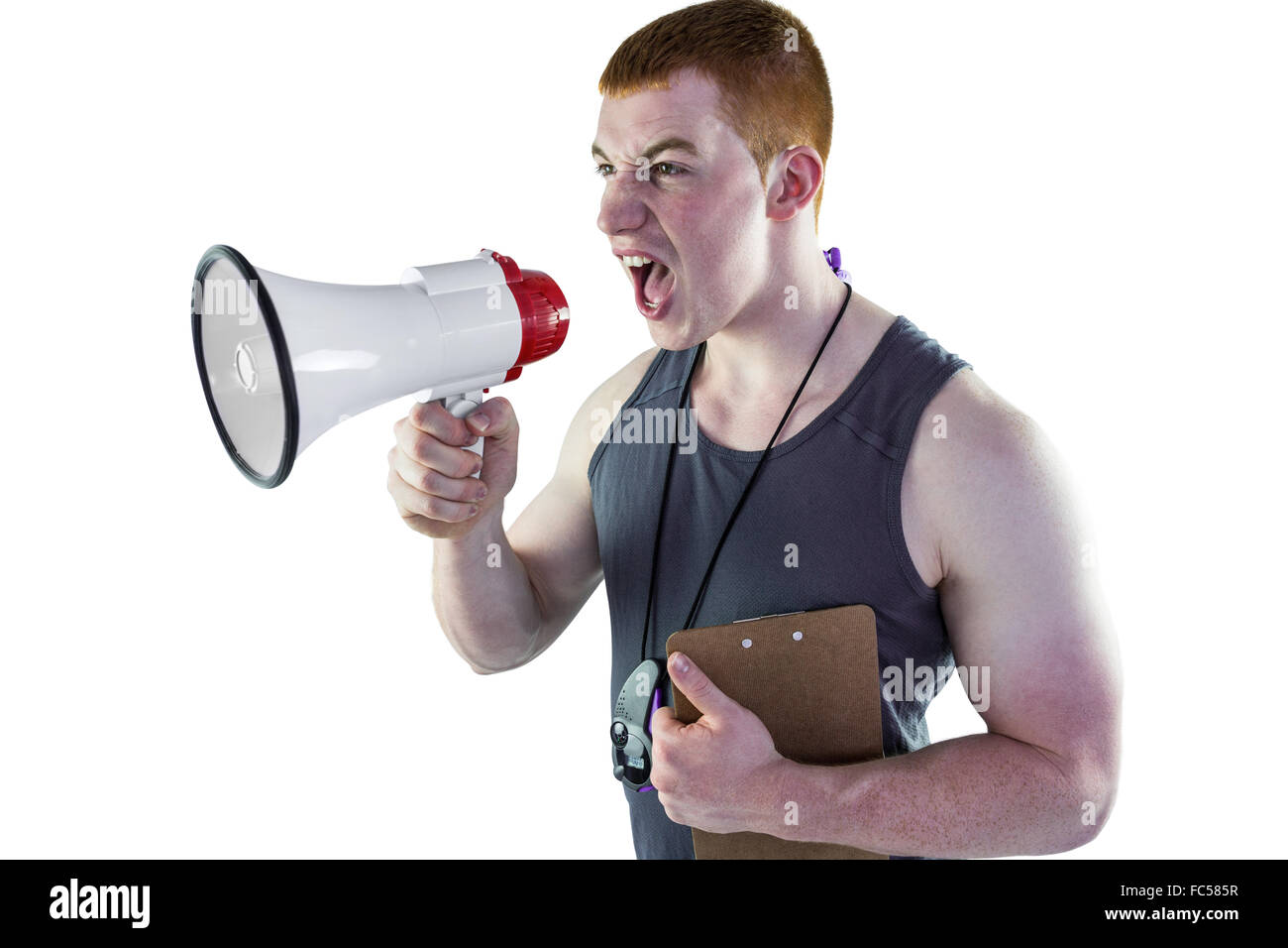 Angry personal trainer yelling through megaphone Stock Photo - Alamy