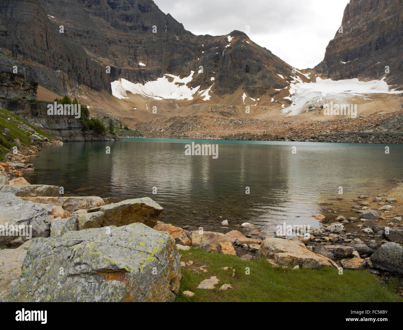 Camp by an emerald green glacier lake hi-res stock photography and ...