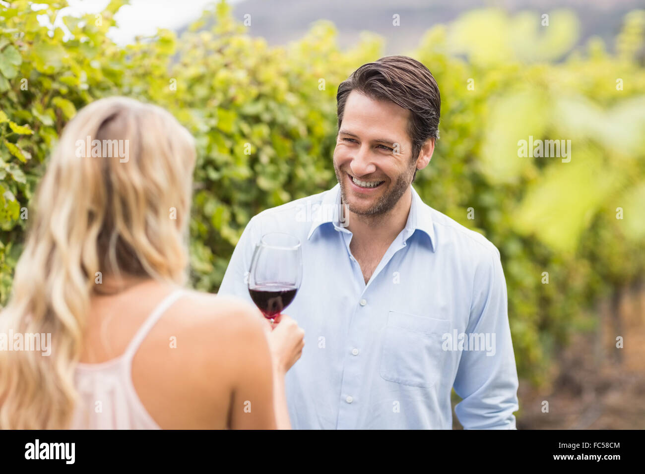 Young happy man smiling at woman Stock Photo - Alamy