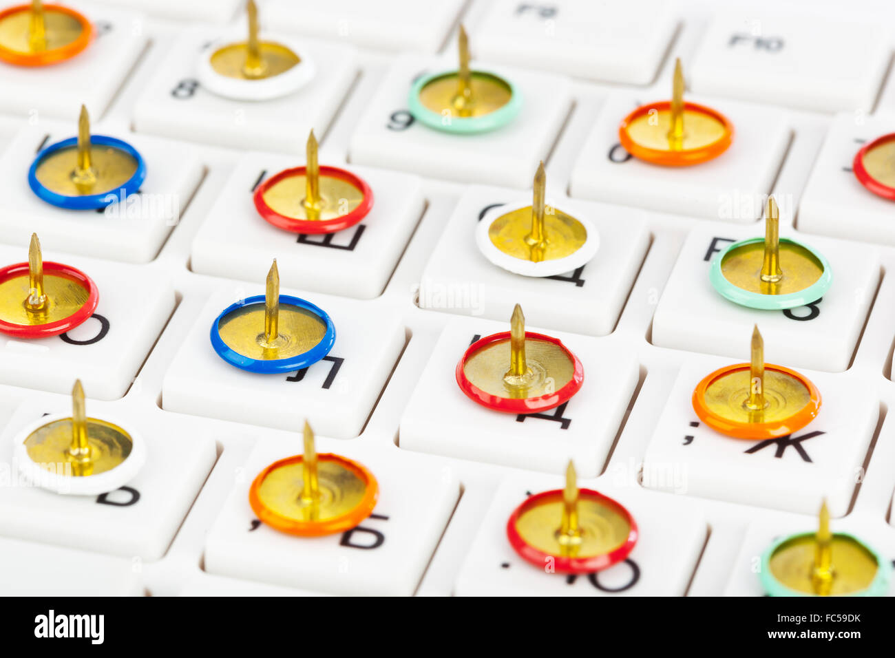 Pins on computer keyboard Stock Photo - Alamy