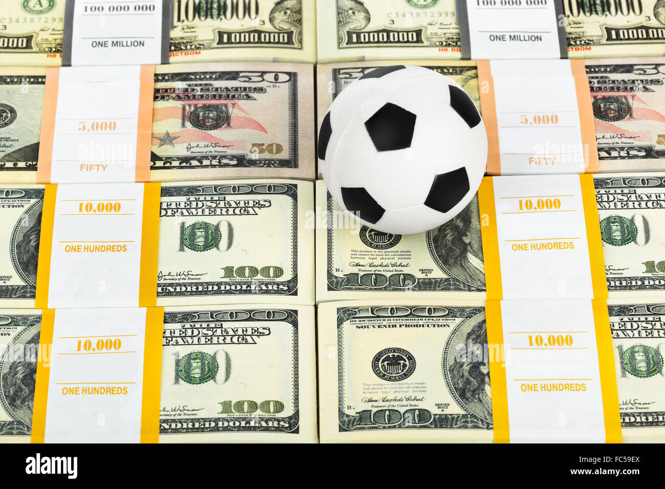 Money and soccer ball Stock Photo - Alamy
