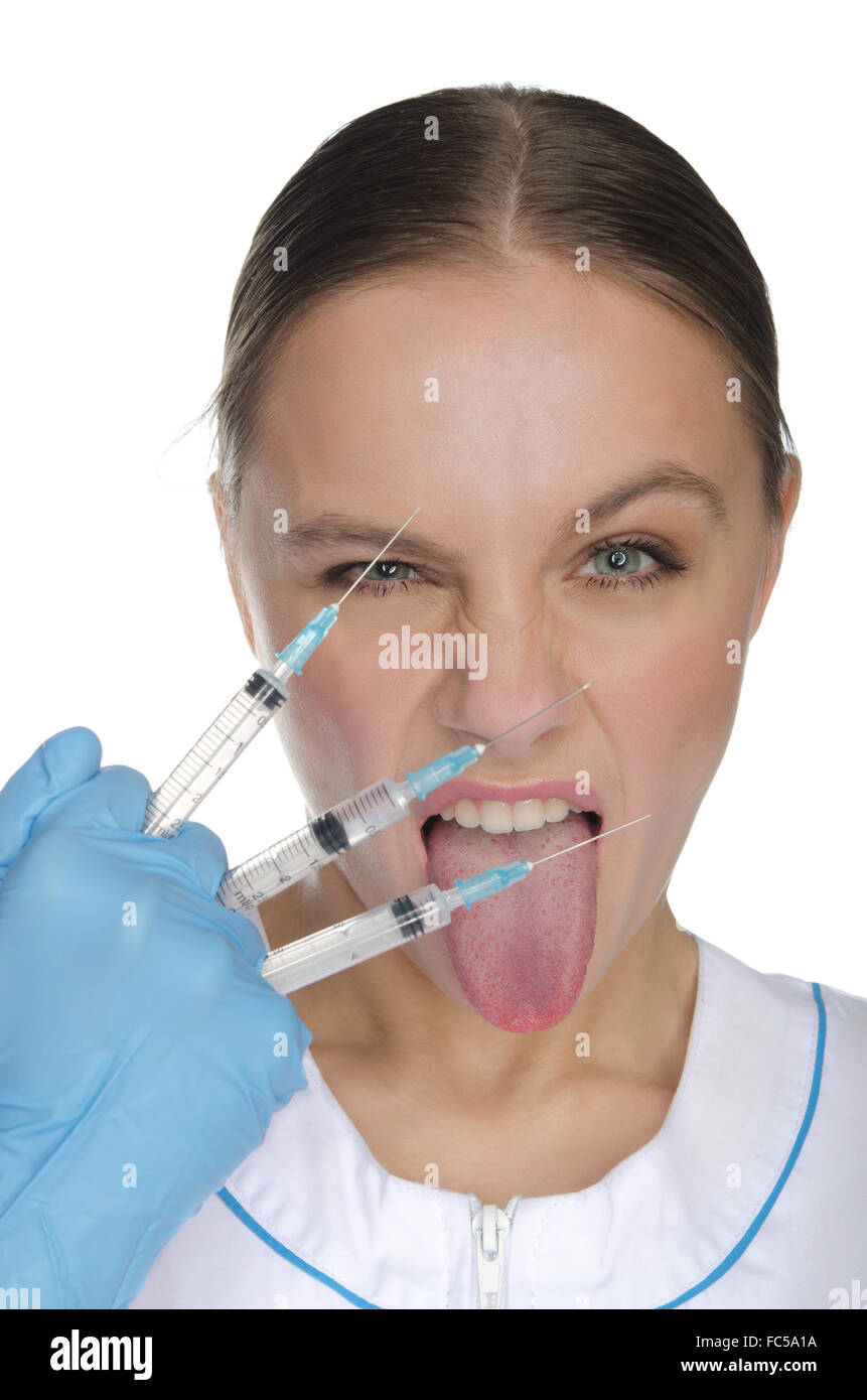 Predatory doctor holding three syringe Stock Photo - Alamy