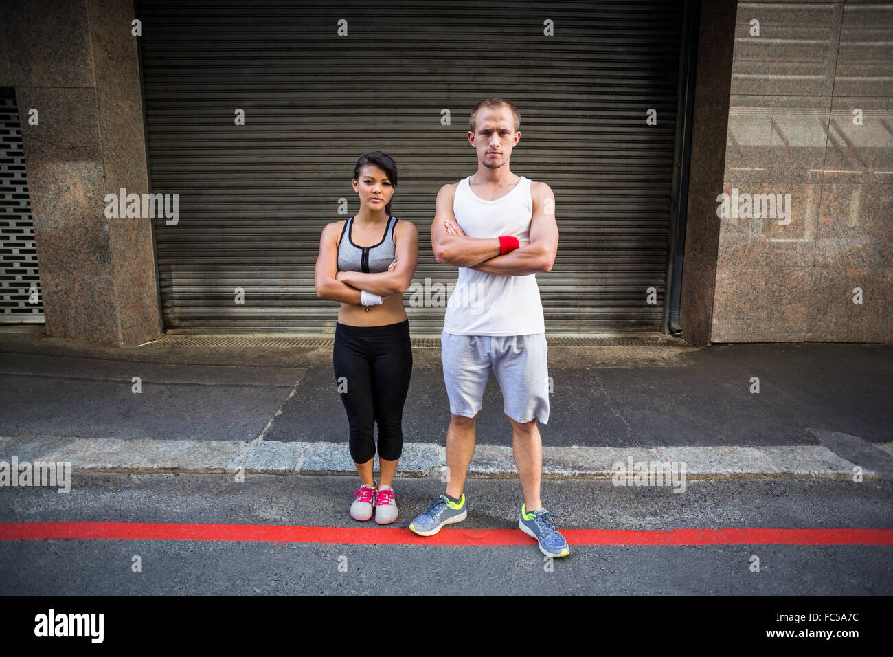 Portrait of extreme athletes standing with arms crossed Stock Photo - Alamy