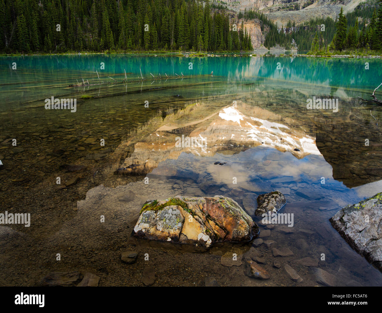 Low-angle view of beautiful, remote Lake O'Hara and Seven Veils Falls ...