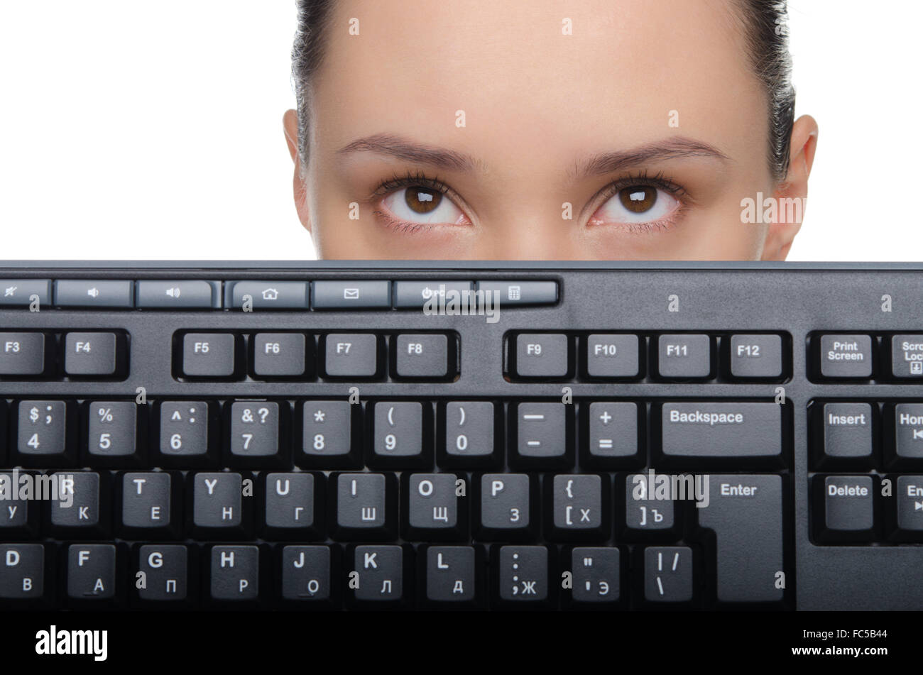 Young lady with a computer keyboard Stock Photo - Alamy
