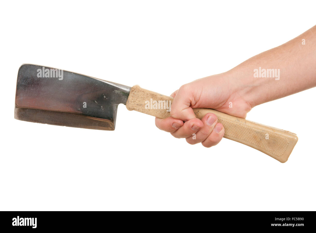 Hand holds hatchet Stock Photo - Alamy