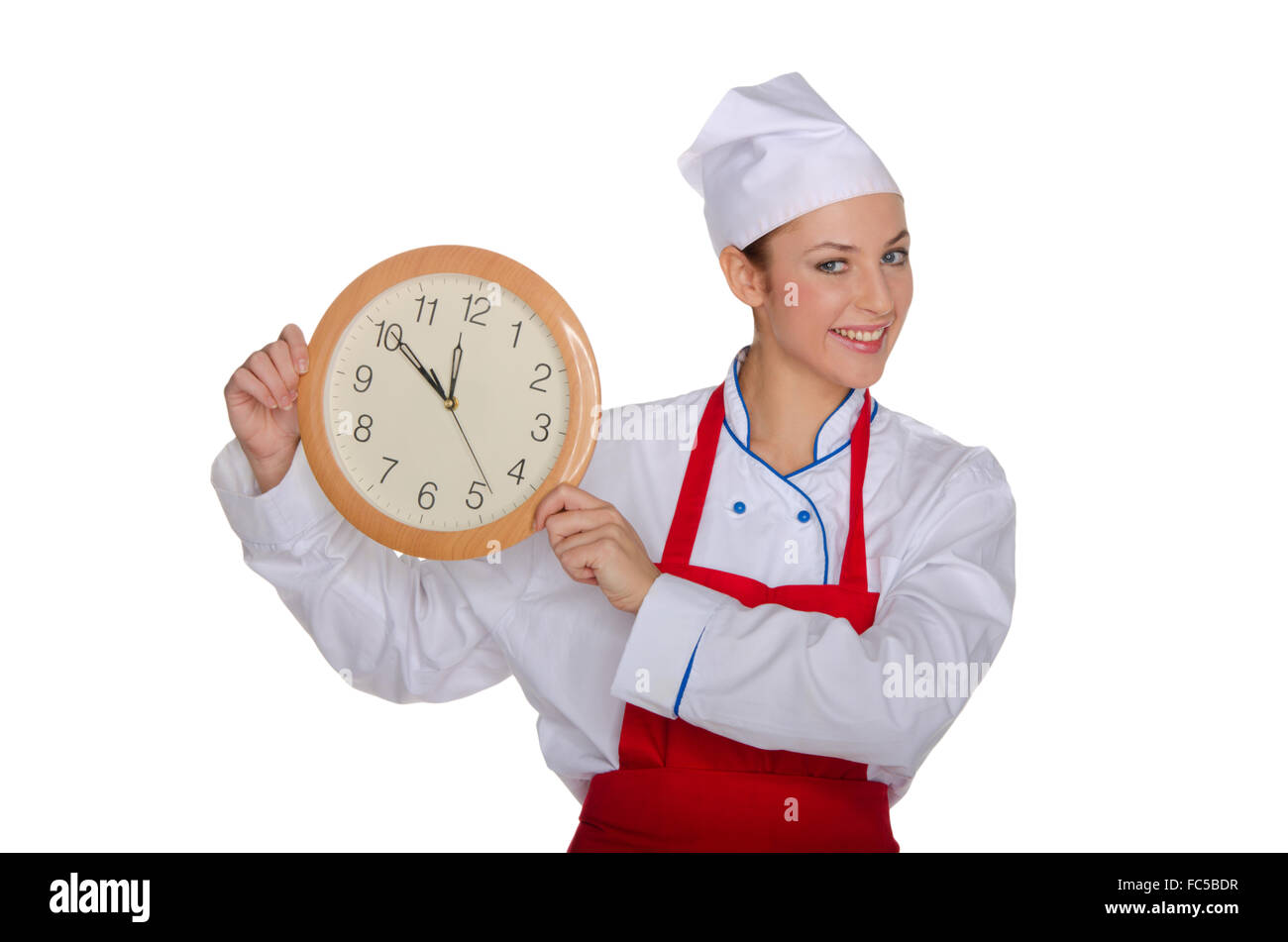 Smiling chef demonstrates clock Stock Photo - Alamy