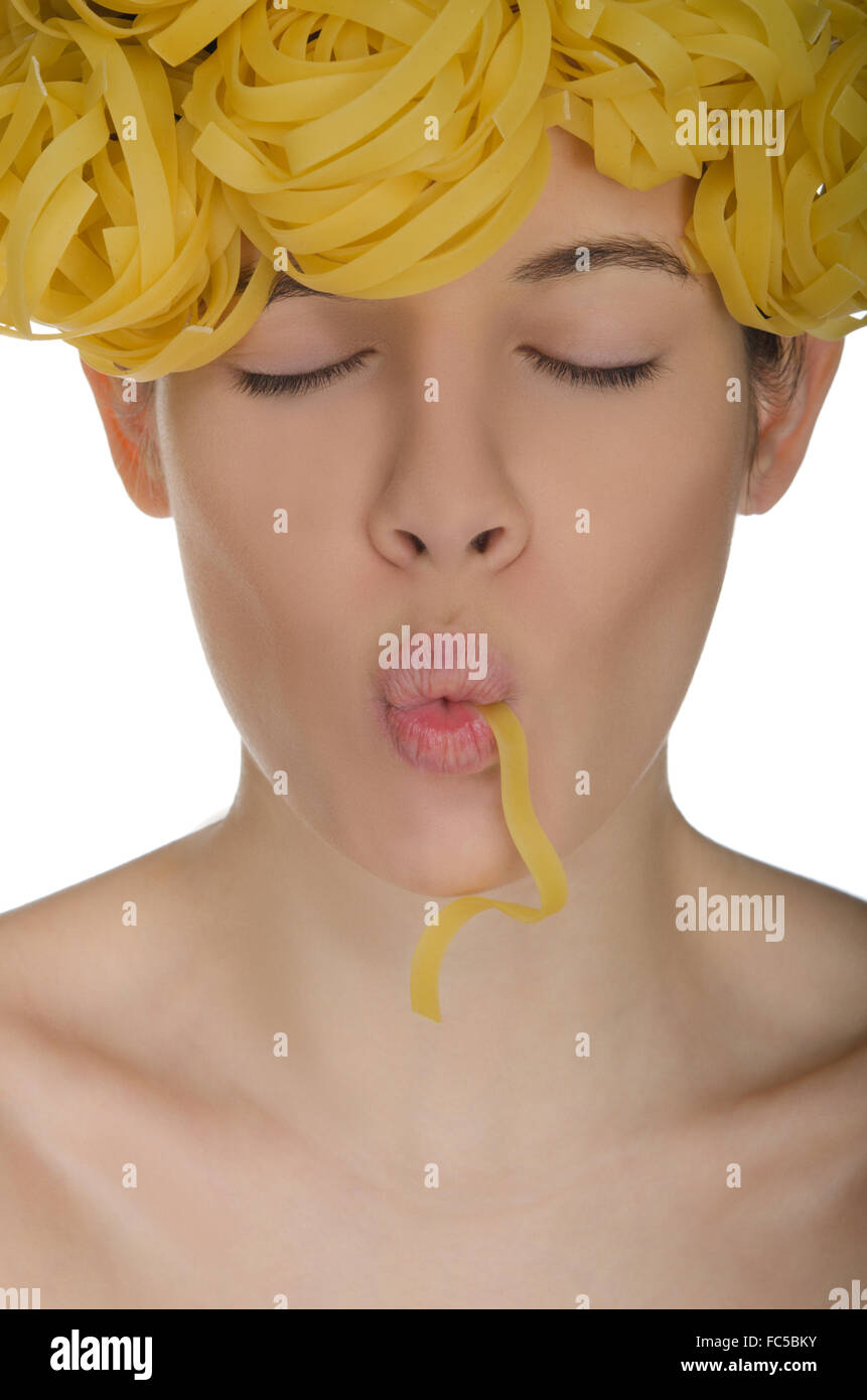 Woman with closed eyes eat pasta Stock Photo - Alamy