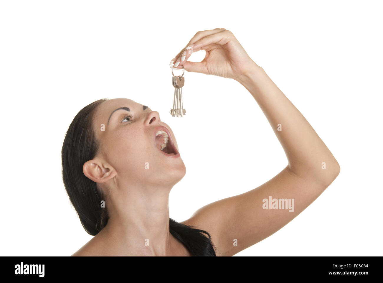 Young woman swallows of keys Stock Photo - Alamy