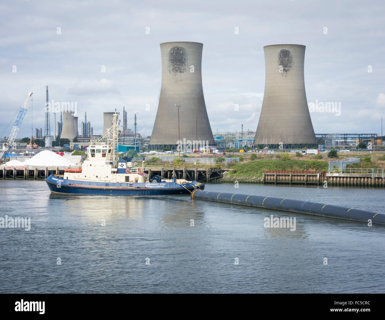 Tug boat towing outflow pipe on the River Tees near Middlesbrough ...