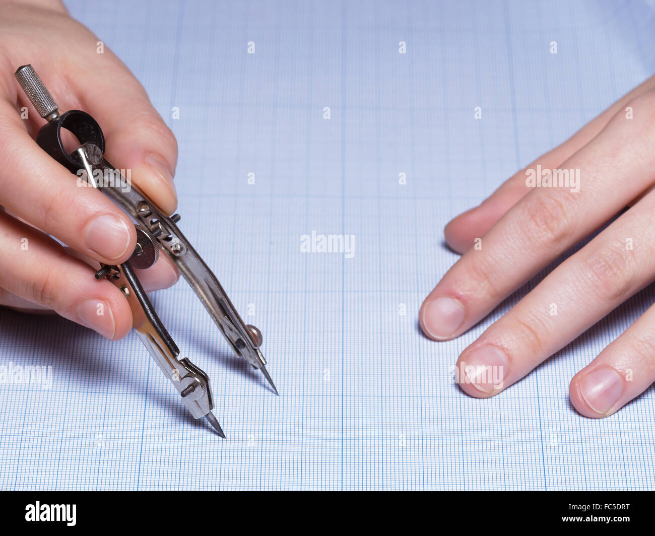 Engineer begins to draw project on special paper using old tools Stock ...