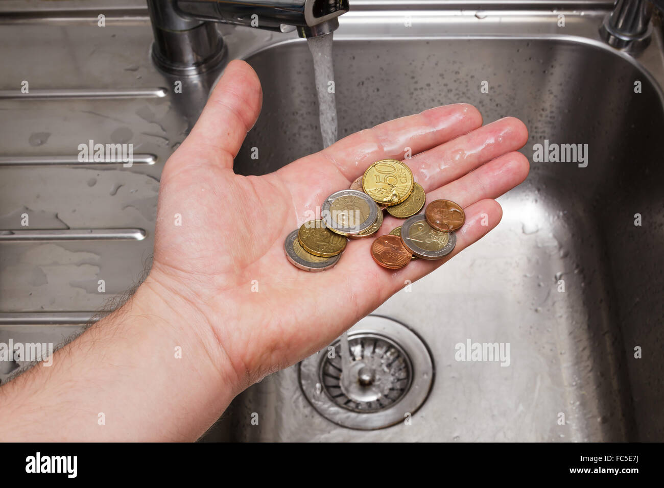 Coin laundry symbol hi-res stock photography and images - Alamy