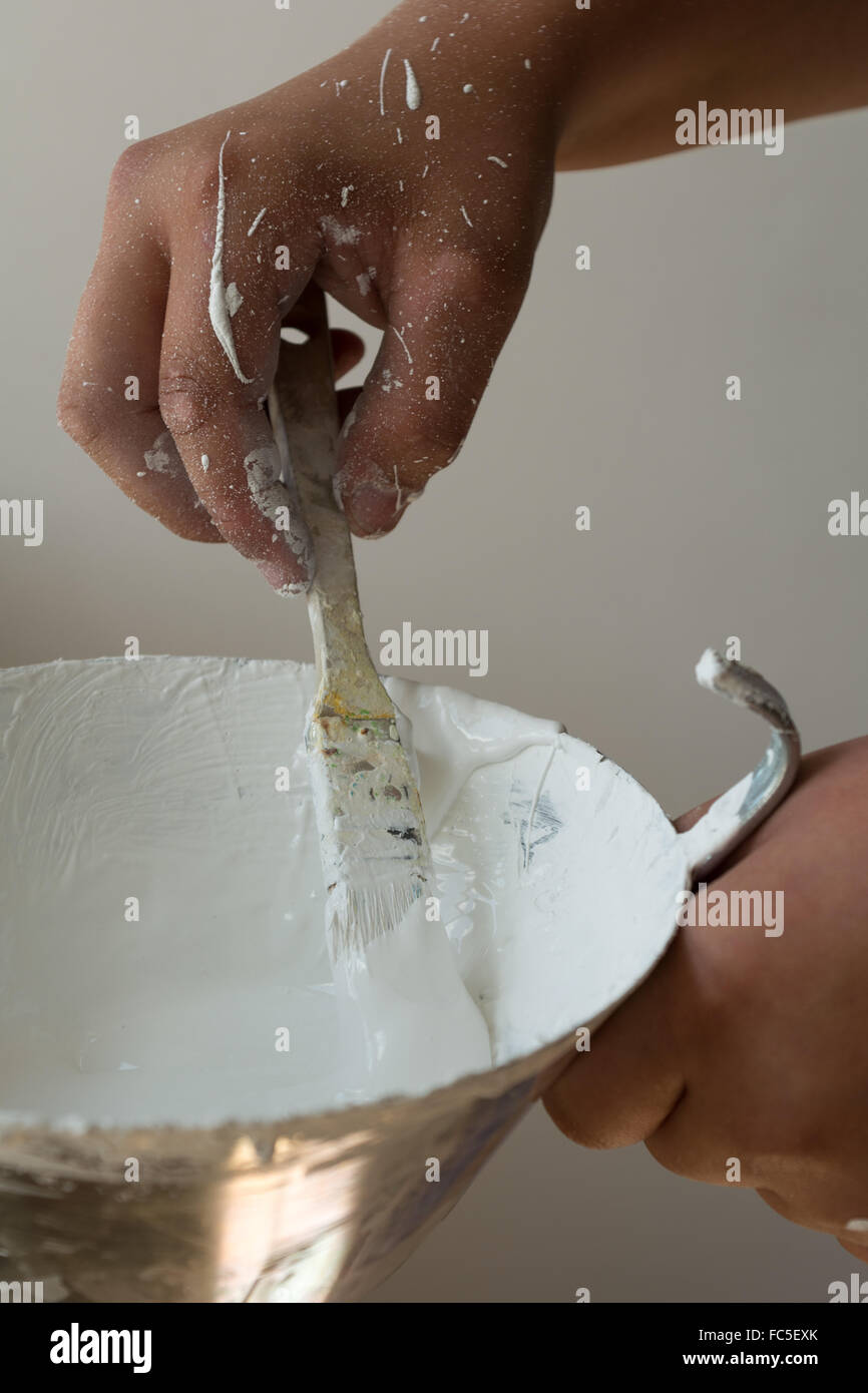 Color stir in tool from bricklayer Stock Photo - Alamy